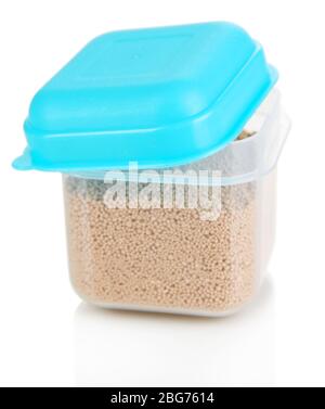 Dry yeast in container isolated on white Stock Photo - Alamy