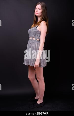 Studio shot of young beautiful Scandinavian woman with blond hair ...