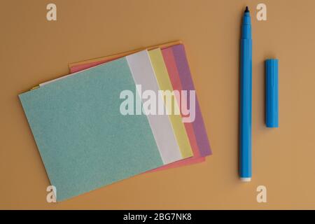Colored square leaflets for reminders top view. Reminder sticky note on ...