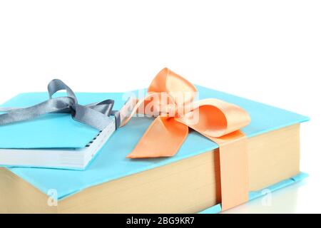 Books wrapped with color ribbons, isolated on white Stock Photo - Alamy