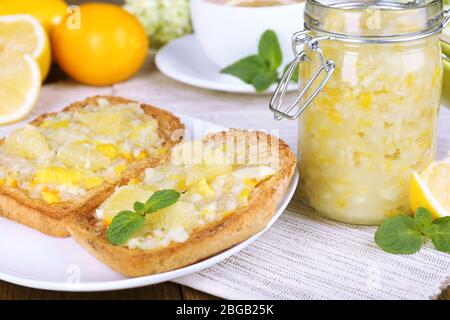 Delicious toasts with lemon jam on plate on table close-up Stock Photo ...