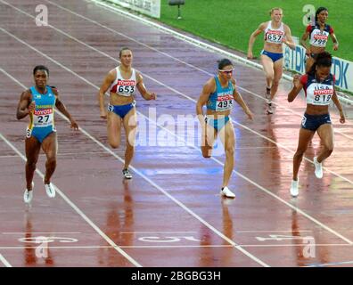 Tonique Williams-Darling of the Bahamas holds her nation's flag in the ...