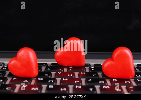 Red hearts on computer keyboard close up Stock Photo - Alamy
