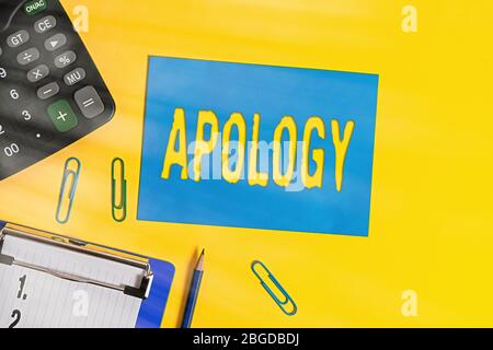 Photo of paper with message sorry and bouquet of flowers on wooden ...