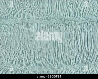 Light turquoise background from a textile material with wicker pattern ...