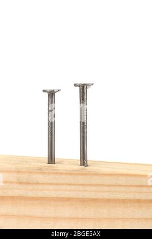 Nails in wooden board close-up Stock Photo - Alamy