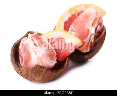 Grapefruit slices in coconut shell isolated on white Stock Photo - Alamy