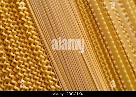 A closeup shot of dried long cut meat hanging on the thin thread on the ...