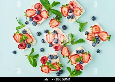Snack with rice crispbread and fresh fruits on metal tray brown ...