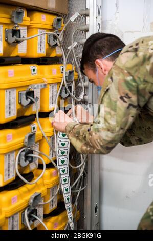 New York National Guard Sgt. Clayton Stock, Jr. observes Pfc. Maya ...