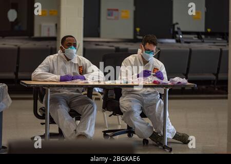 A health worker stands by a drive-through COVID 19 testing post amidst ...