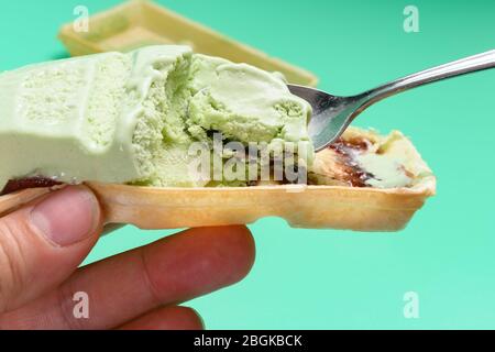 ice cream blocks with wafer outside on a green background Stock Photo ...