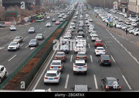 Traffic stream, composed of vehicles transporting passengers, moves on ...