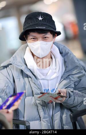Chinese singer Charlie Zhou Shen arrives at a Shanghai airport after ...