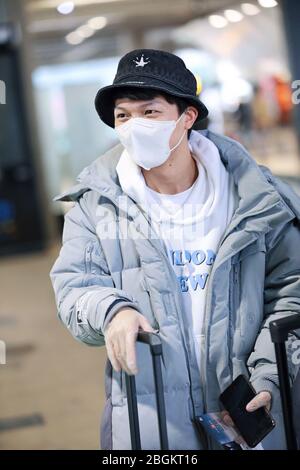 Chinese singer Charlie Zhou Shen arrives at a Shanghai airport after ...