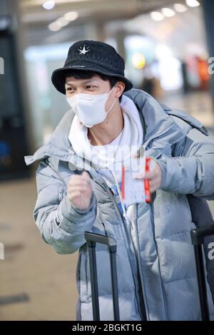 Chinese singer Charlie Zhou Shen arrives at a Shanghai airport after ...