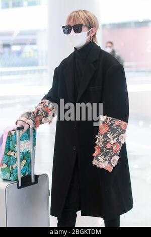Liu Ye of Chinese idol boy band R1SE arrives at a Beijing airport after ...