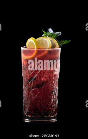 Fresh cucumber slices and mint leaves on a blue background, overhead ...