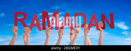 People Hands Holding Word Ramadan, Grass Meadow Stock Photo - Alamy