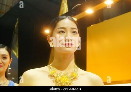 Female models display new gold jewelry Stock Photo - Alamy