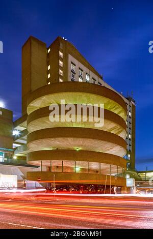Brutalism architecture. A spiral concrete ramp and walkway to ...