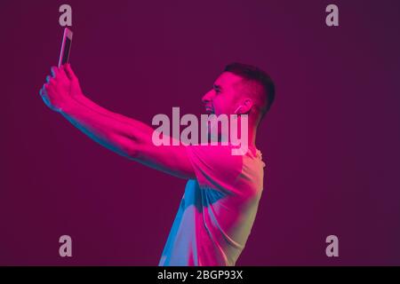 Selfie, vlog, shopping, betting. Caucasian man's portrait isolated on ...