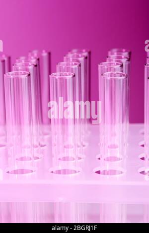Empty test-tubes with on purple background Stock Photo - Alamy