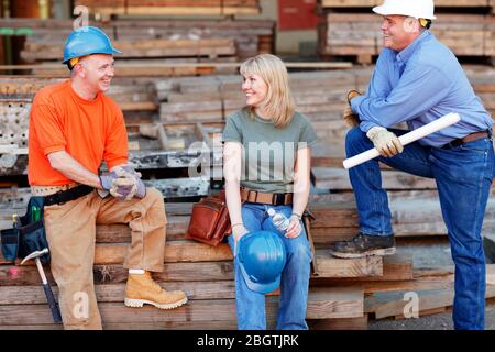 Group of construction workers taking a break standing in front Stock ...