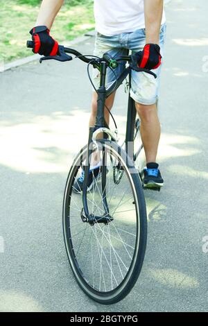 Man biking fast in city park. View from bikers eyes Stock Photo - Alamy