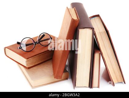 Books in a mess and glasses isolated on white Stock Photo - Alamy