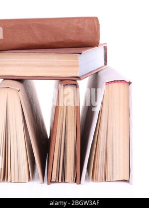 Books in a mess isolated on white Stock Photo - Alamy