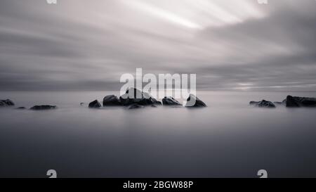 Coastal rocks mono long exposure- Happisburgh, June 2017 Stock Photo ...