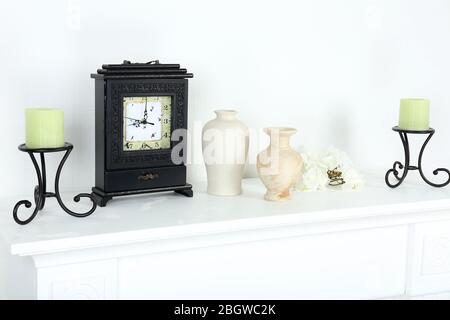 Different objects on white shelf in living room Stock Photo - Alamy