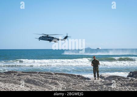 A person and a helicopter of the armed forces of mexico supports the ...