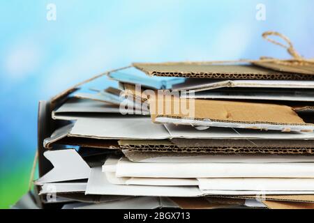 Big stack of papers on blue background, close-up Stock Photo - Alamy