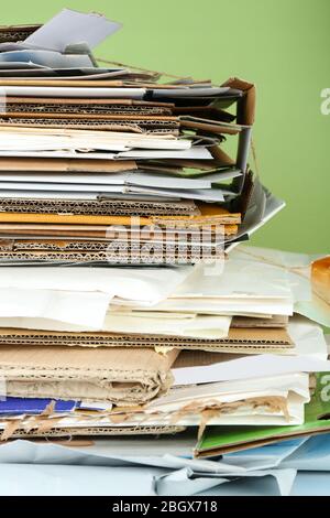 Big stack of papers on green background, close-up Stock Photo - Alamy