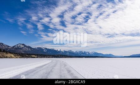 frozen Windermere lake and rocky mountains in british columbia canada ...