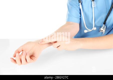 Taking heart rate oneself by hand, on white background Stock Photo - Alamy