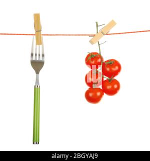 Tomatoes hanging on a rope. Isolated over black background Stock Photo ...