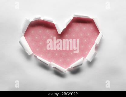 Torn paper heart over colorful background Stock Photo - Alamy