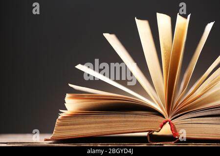 Open book over dark colorful background Stock Photo - Alamy