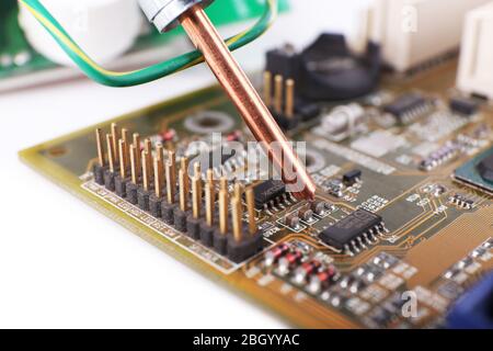 Motherboard repairing on white background Stock Photo - Alamy
