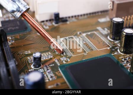 Repairing of computer motherboard, macro view Stock Photo - Alamy