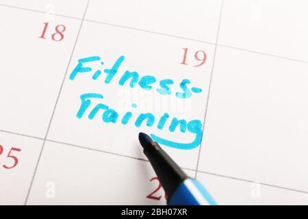 Written plan Fitness Training on calendar page background Stock Photo ...