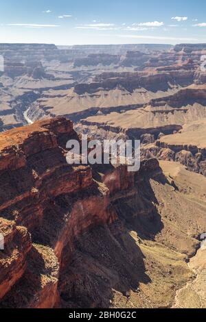 Scenic view of a majestic canyon under a clear blue sky at sunset. USA ...