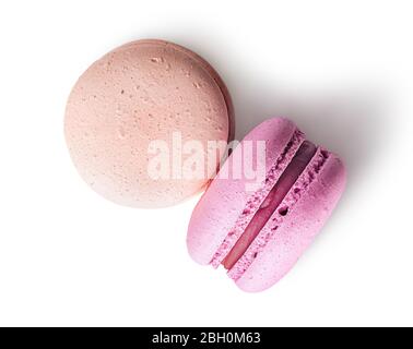 Two macaroon beige pink top view on white background Stock Photo - Alamy