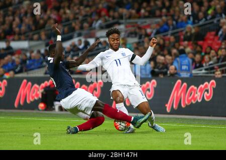 Raheem Sterling of Englandbattles with Bacary Sagna of France during ...