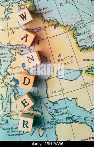 Wander word written in wooden blocks on a vintage travel map Stock ...