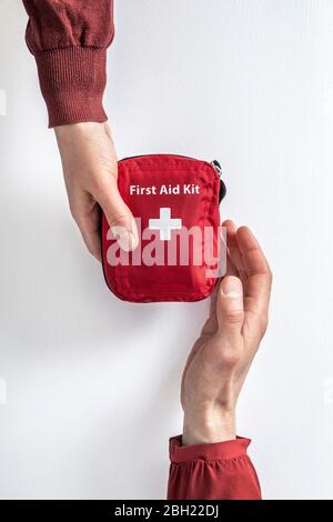 Man with first aid kit in the office Stock Photo - Alamy