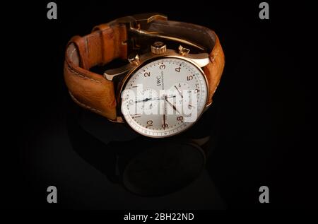 Luxury watches laying flat on a black reflective panel Stock Photo - Alamy